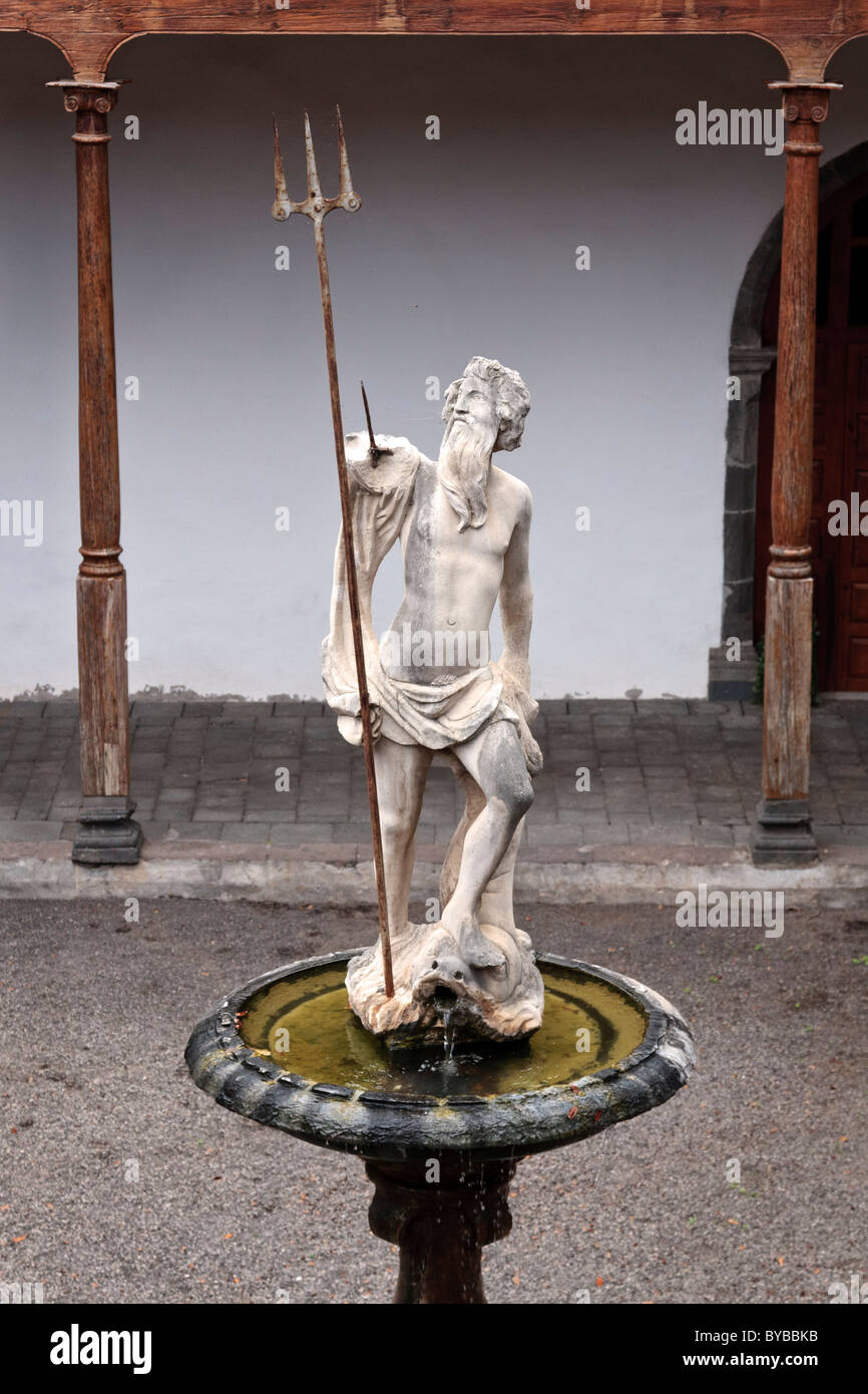 Statue of Neptune with one arm missin, in the courtyard of the library ...