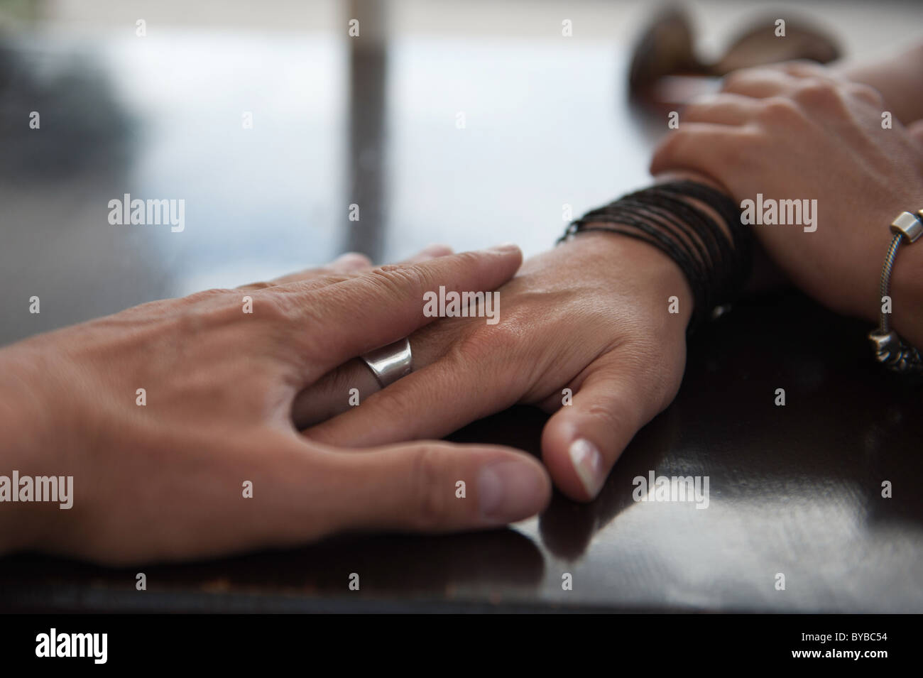 Man and Woman holding hands Stock Photo - Alamy