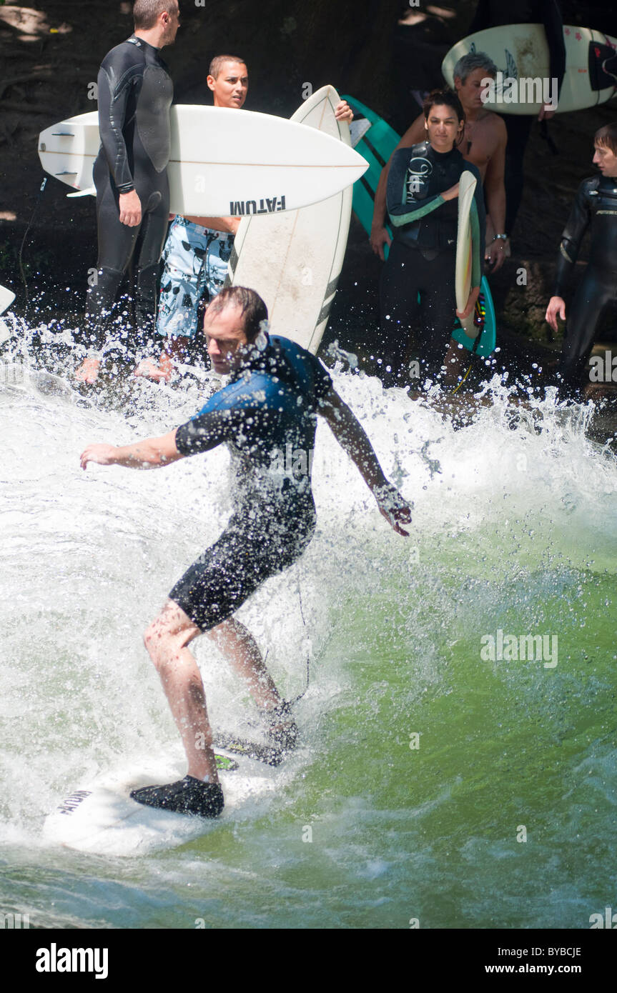 River surfing on the Eisbach in Munich, Germany Stock Photo - Alamy