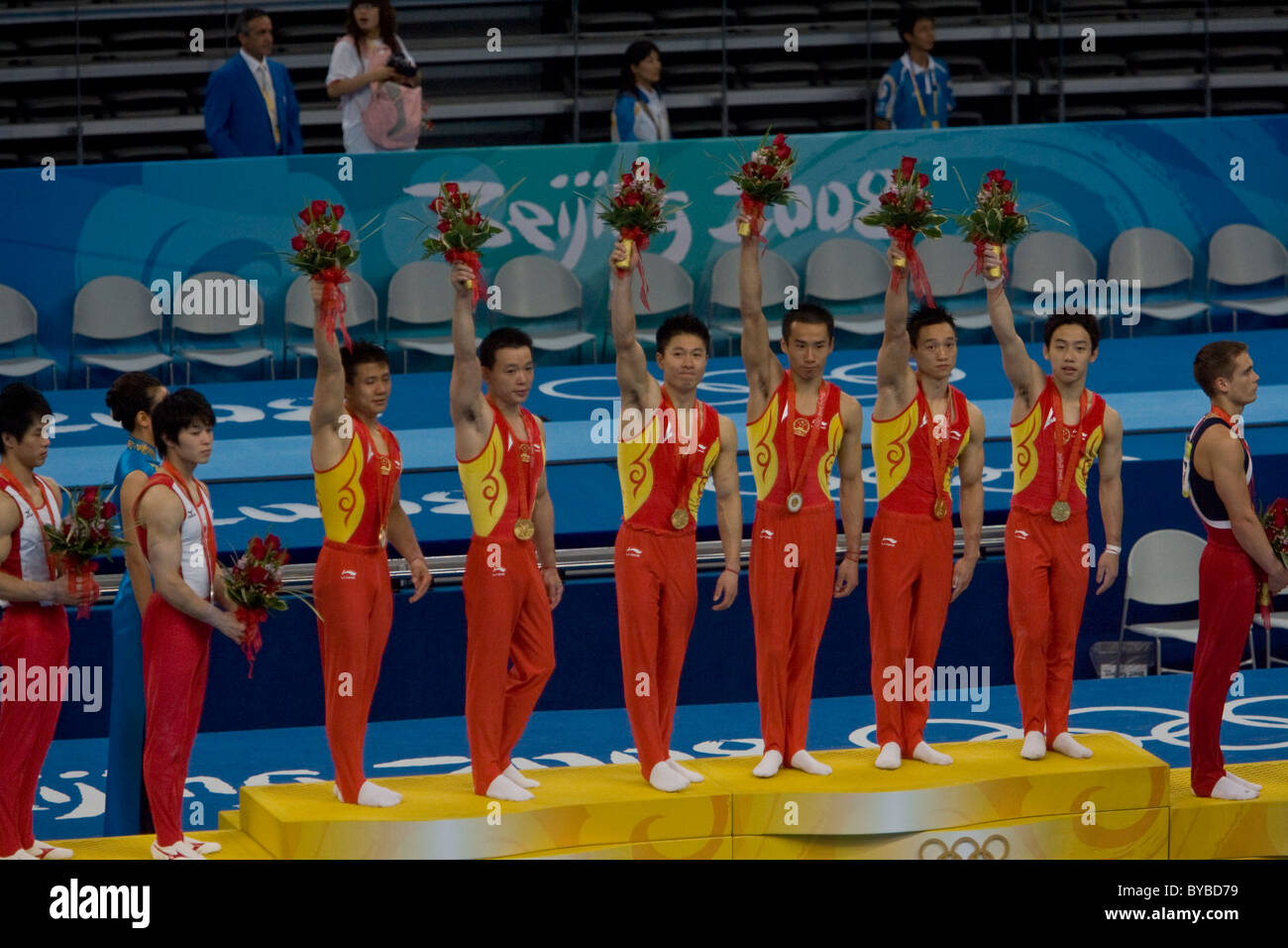 Gold medal winning Chinese men's gymnastic team on the podium at the ...
