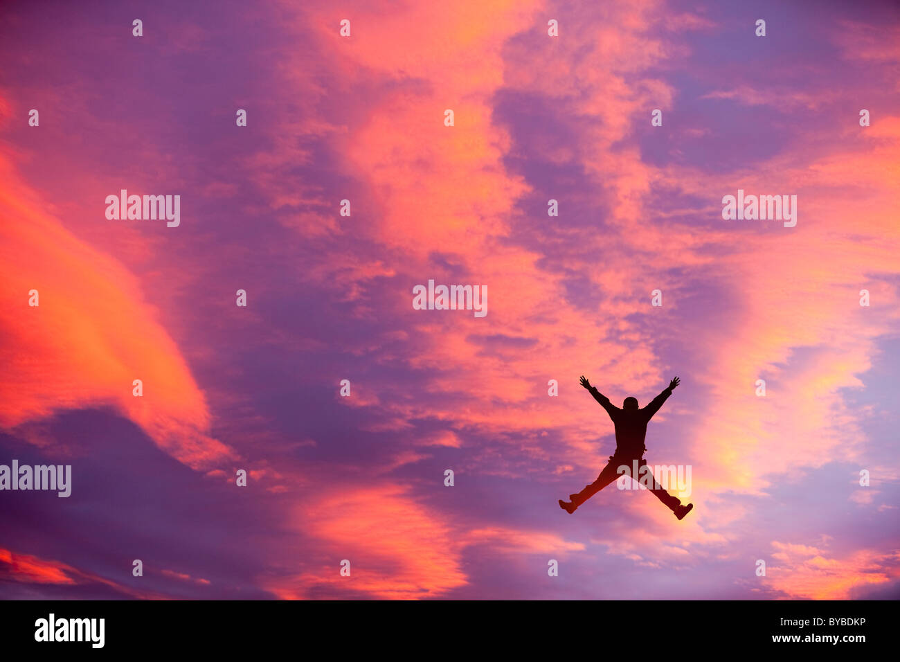 Silhouette jumping man sunset hi-res stock photography and images - Alamy