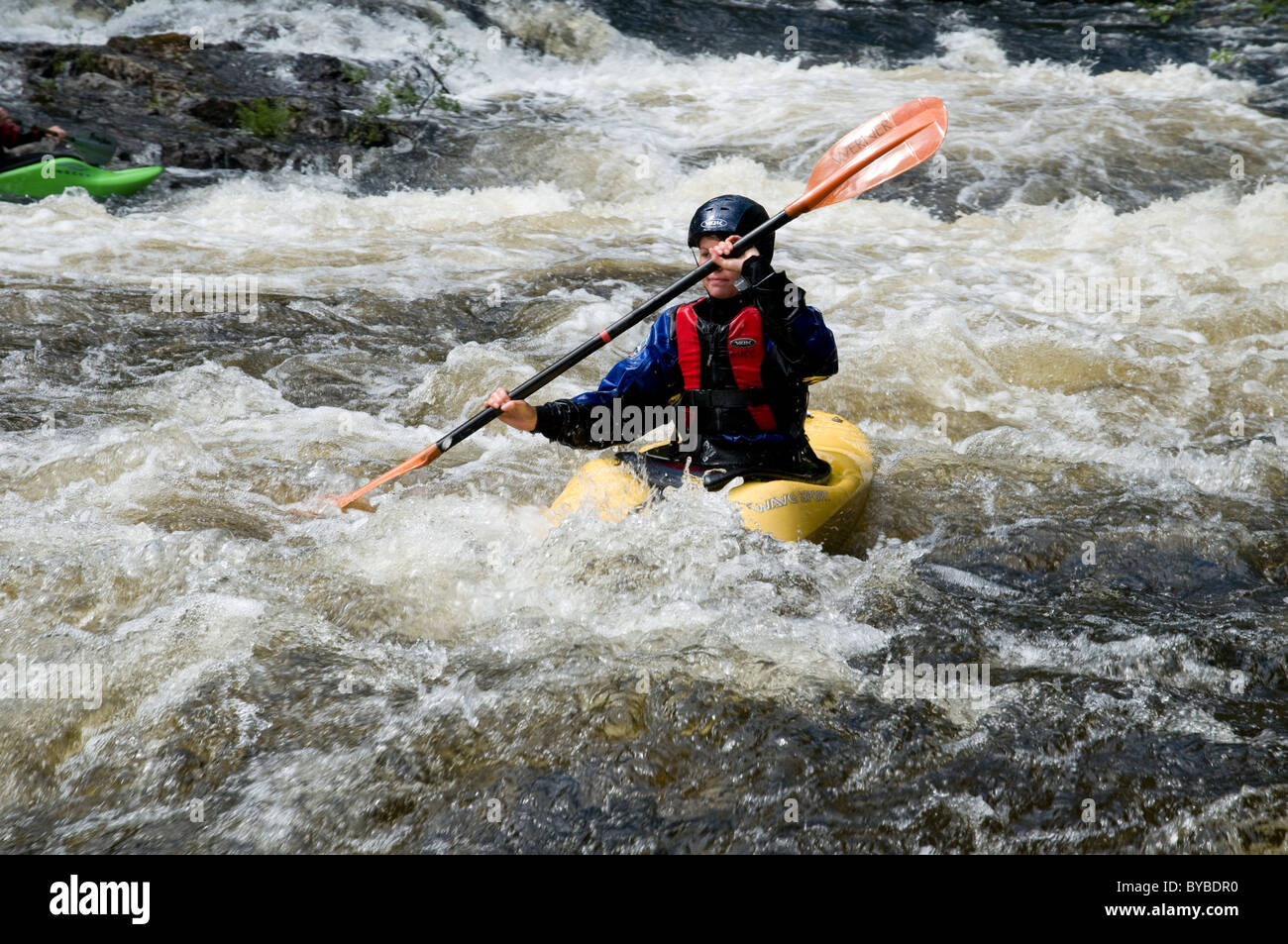 Person white water canoeing Stock Photo - Alamy