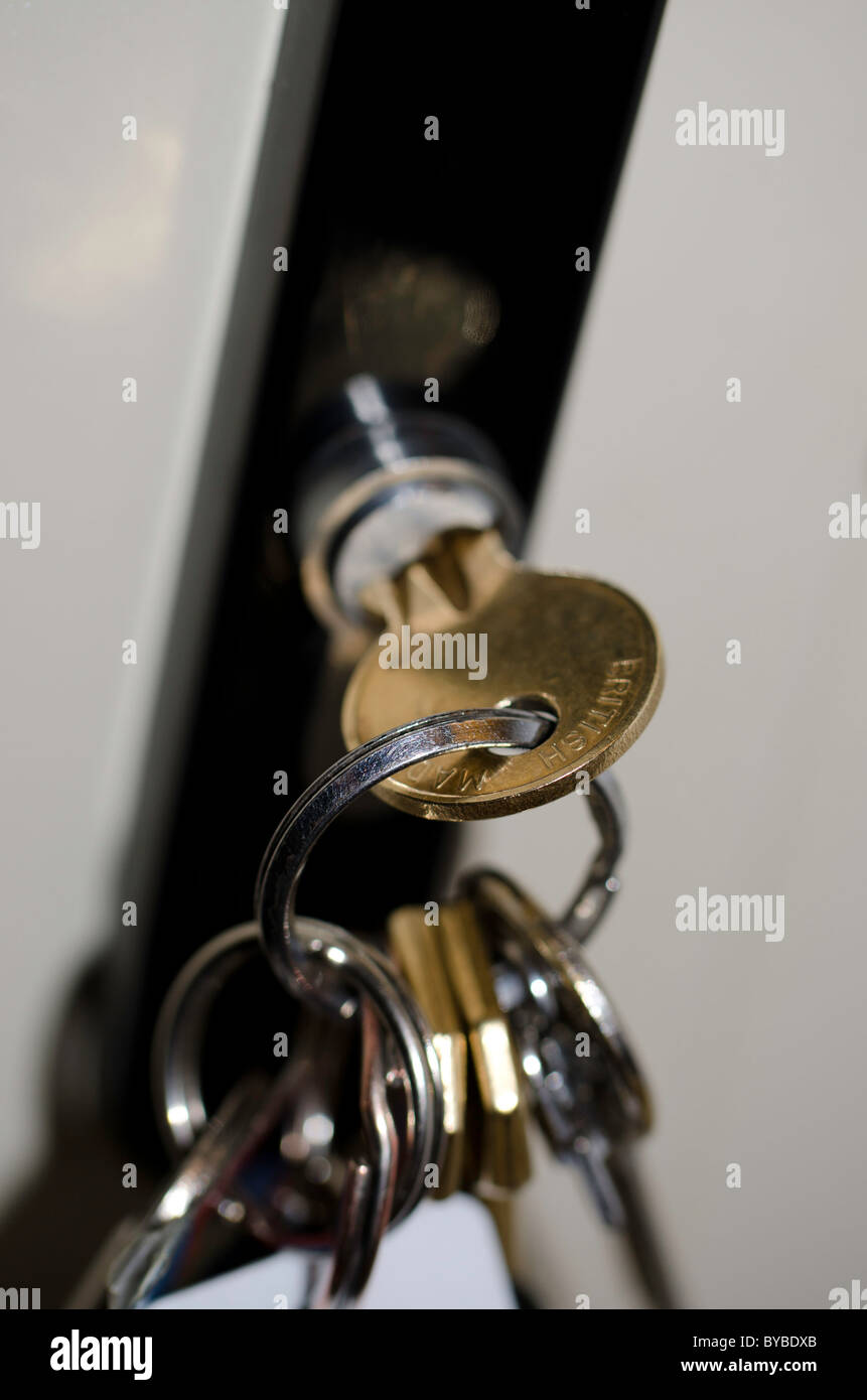 Key in Lock Stock Photo - Alamy