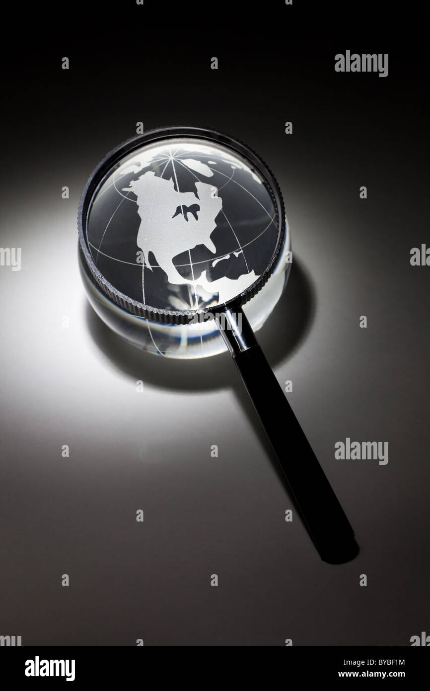 Globe and Magnifying Glass for background Stock Photo - Alamy