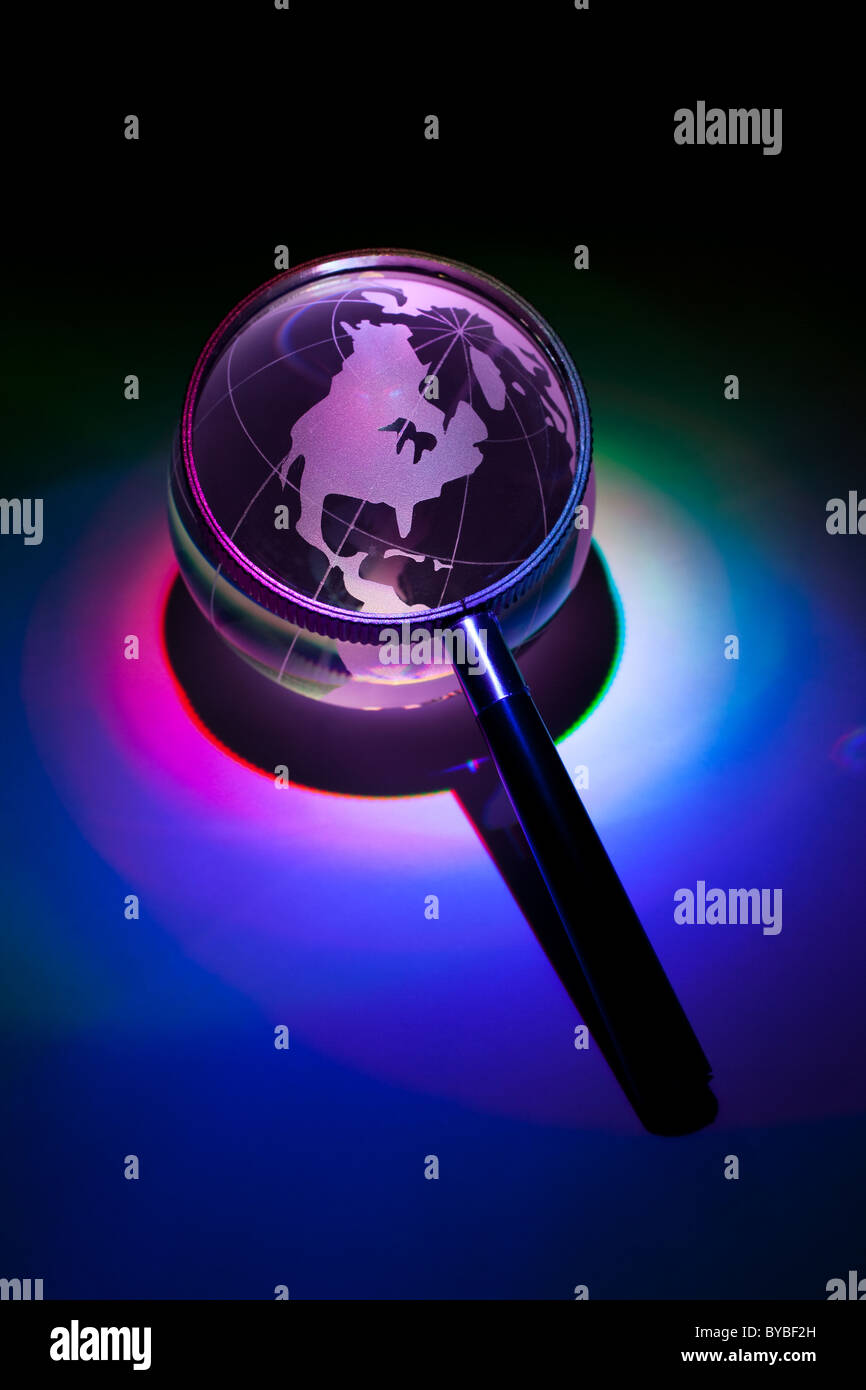 Globe and Magnifying Glass for background Stock Photo - Alamy