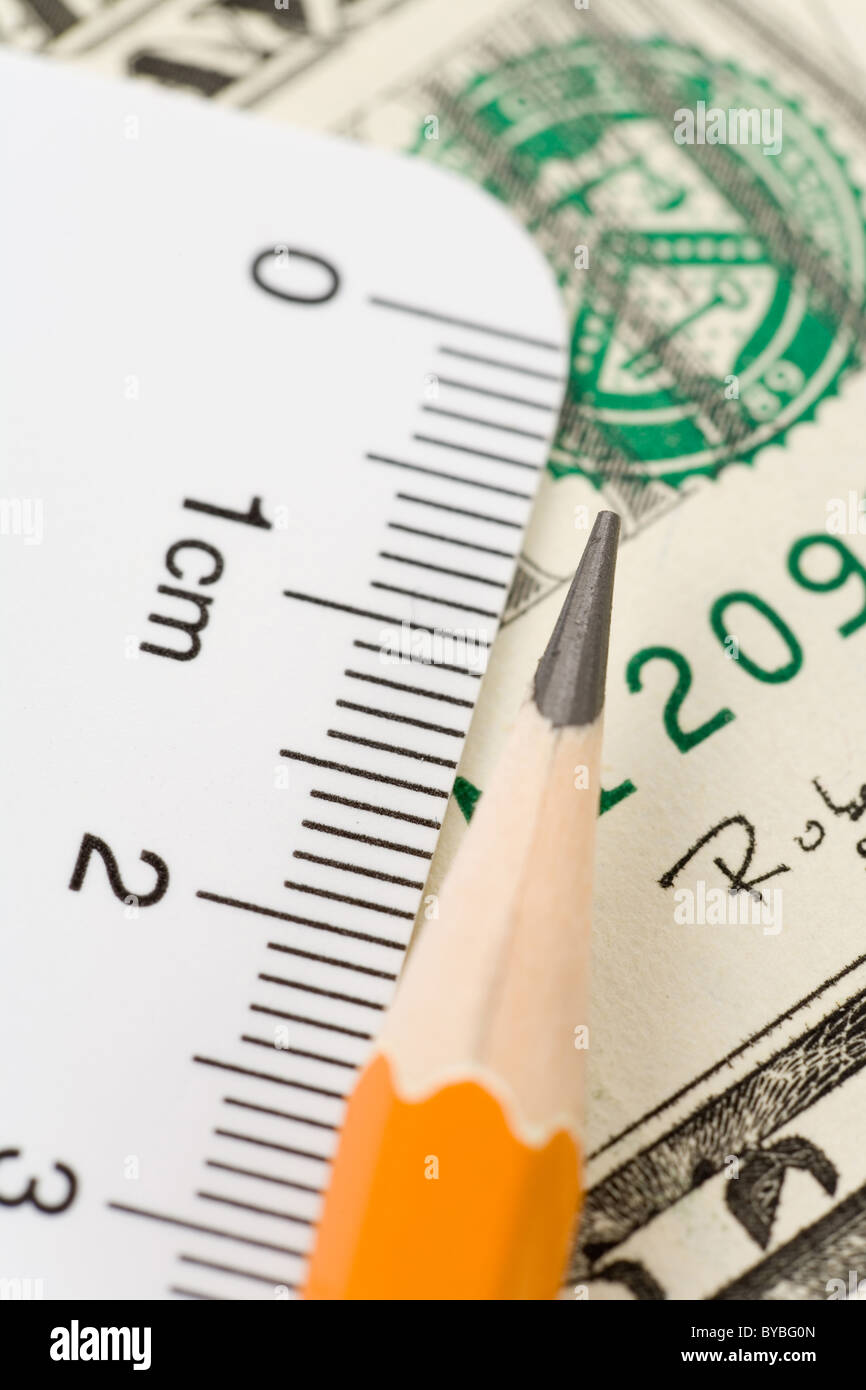White ruler and dollar close up shot Stock Photo - Alamy