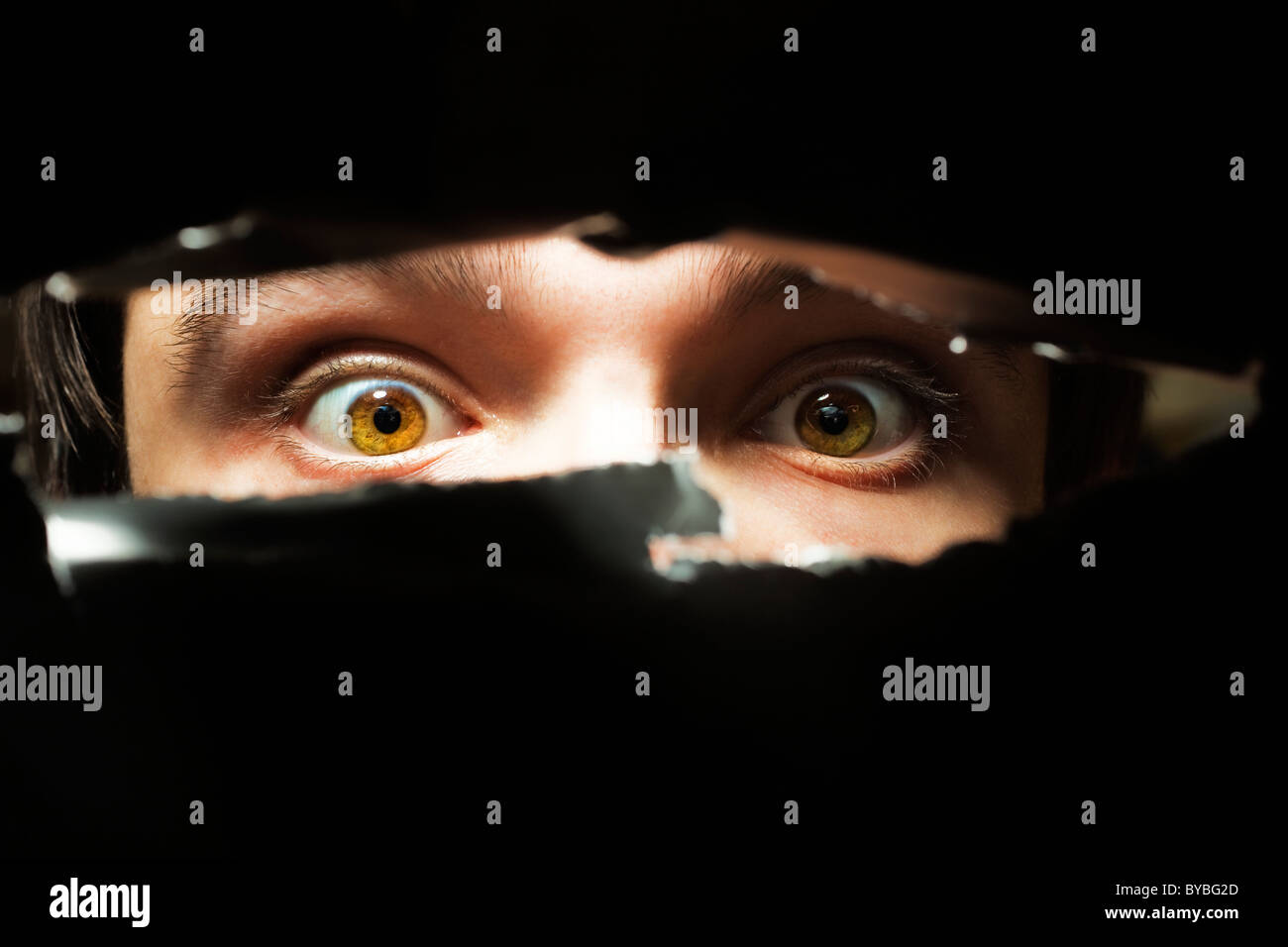 Man spying through hole in hi-res stock photography and images - Alamy