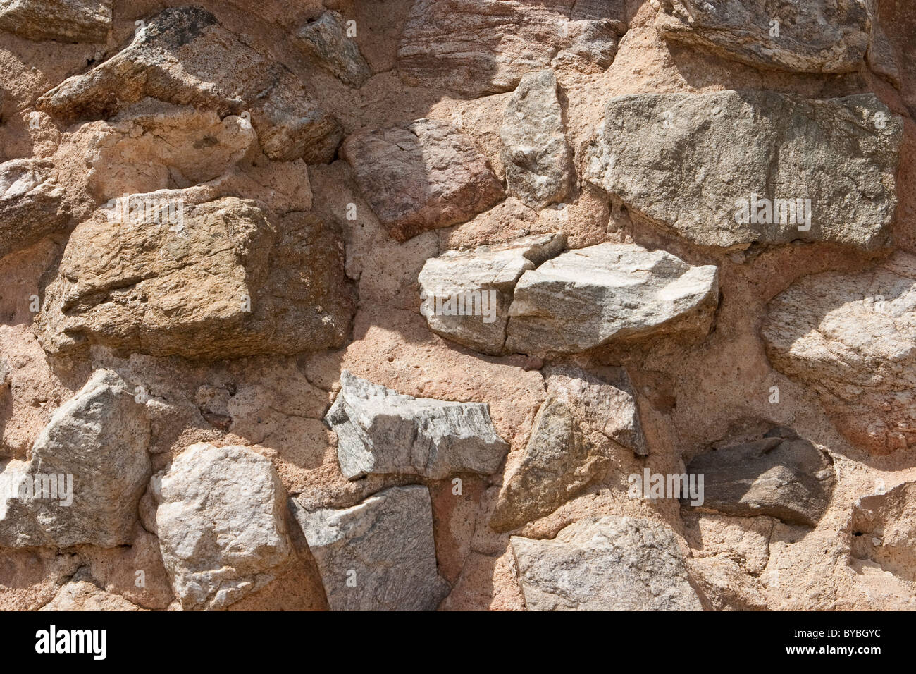 Rough sand stone wall background Stock Photo - Alamy