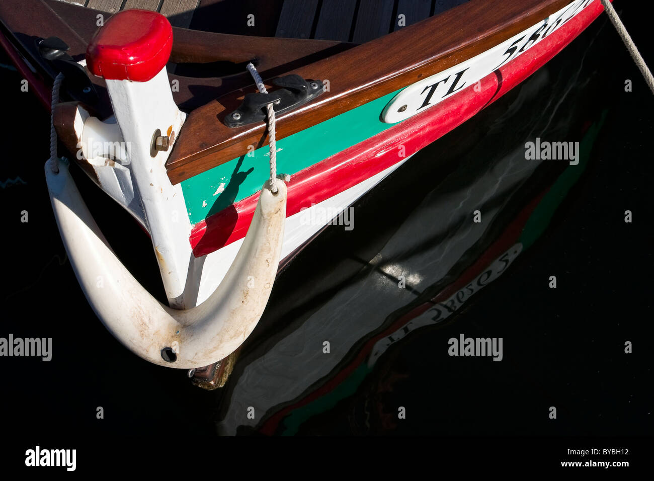 A single fishing boat with reflection Stock Photo - Alamy