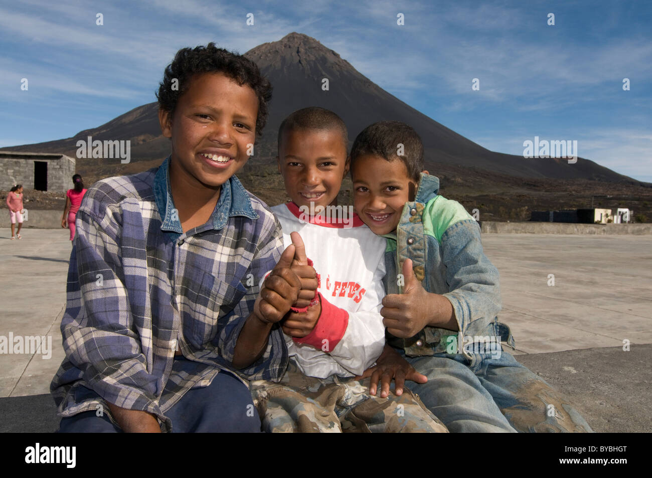 Smiling boys in front of volcano on Fogo, Cabo Verde, Africa Stock ...