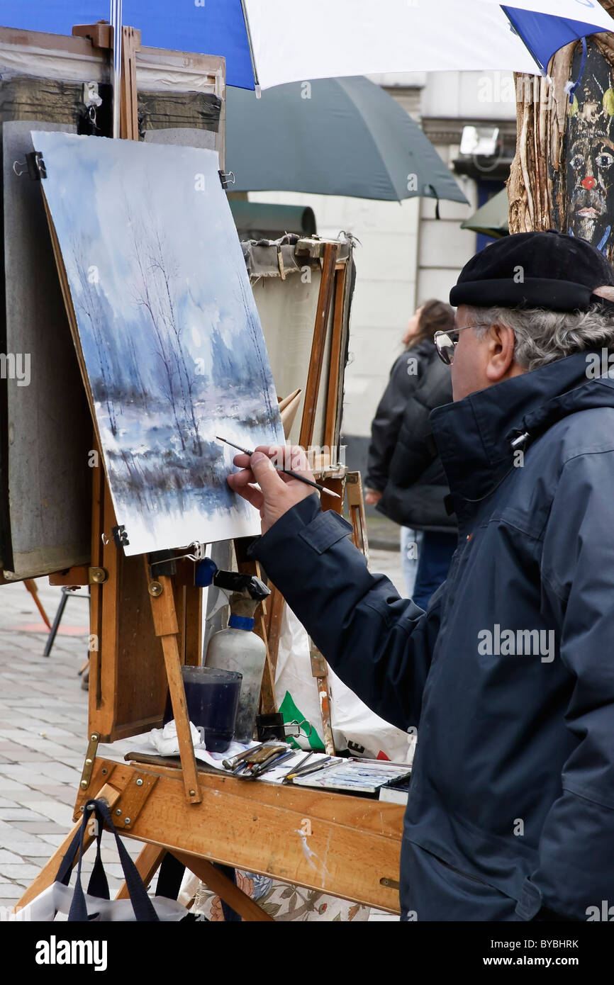 A typical artist painting and selling their work "Montmartre Paris ...