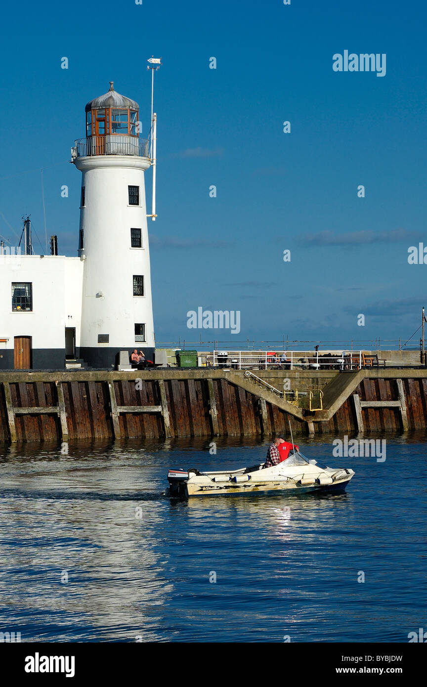 pleasure boat passing Scarborough lighthouse England UK Stock Photo - Alamy