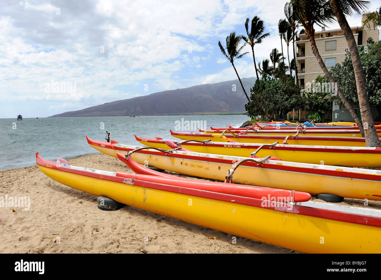 Yellow and Red Outriggers on beach Kihei Maui Hawaii Pacific Ocean ...