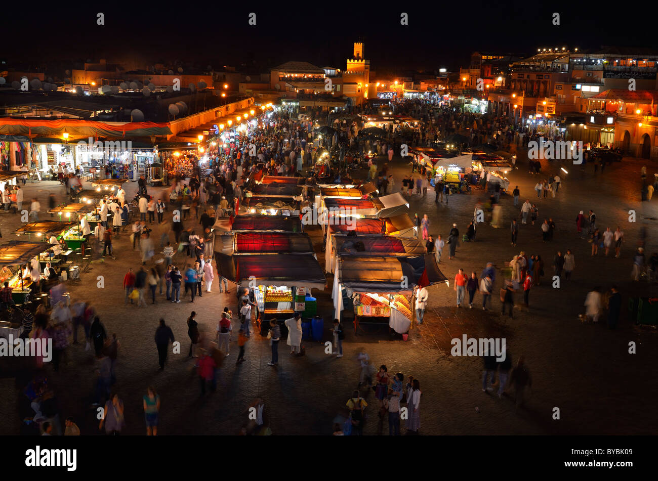Overview of food vendors and shops at night in Place Djemaa el Fna ...