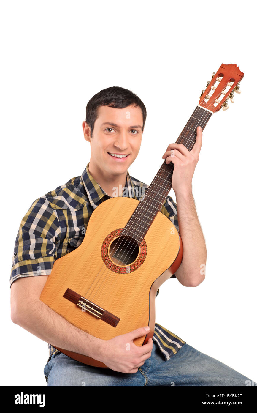 A young man playing acoustic guitar Stock Photo - Alamy