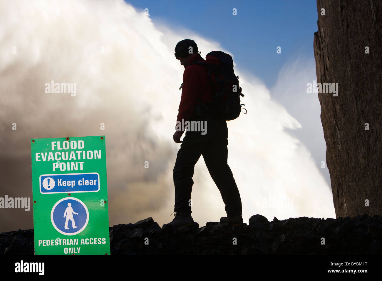 A person crosses near the overflow from Karahnjukar dam and Halslon ...