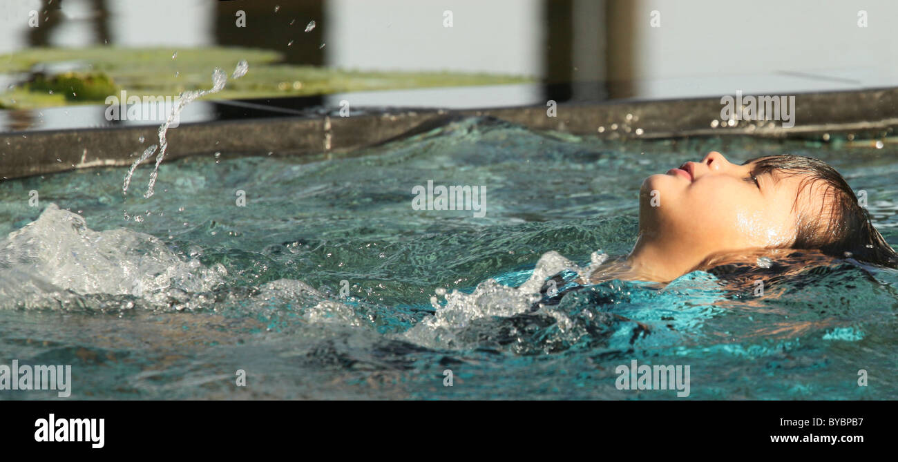 5yr old, boy, floating along on his back in a swimming pool Stock Photo ...