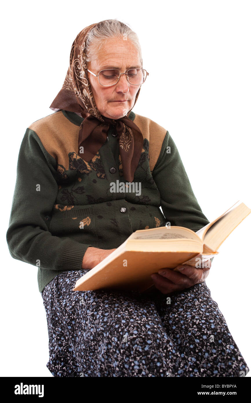 Portrait of an old woman reading a book, isolated on white Stock Photo ...