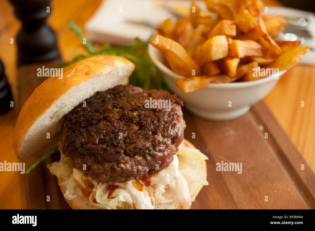 burger hand made with chips Stock Photo - Alamy