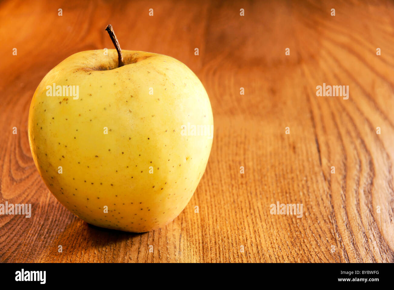 Golden delicious apple on kitchen wooden table with copy space Stock ...
