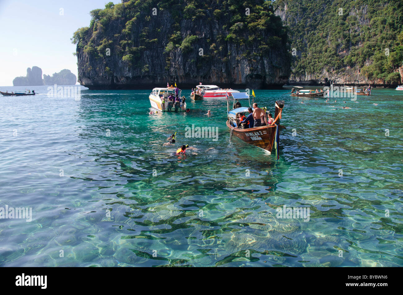 Thailand, Andaman Sea, Phuket. Maya Bay, Phi Phi Leh (aka Phi Phi Island), longtail boat with ...