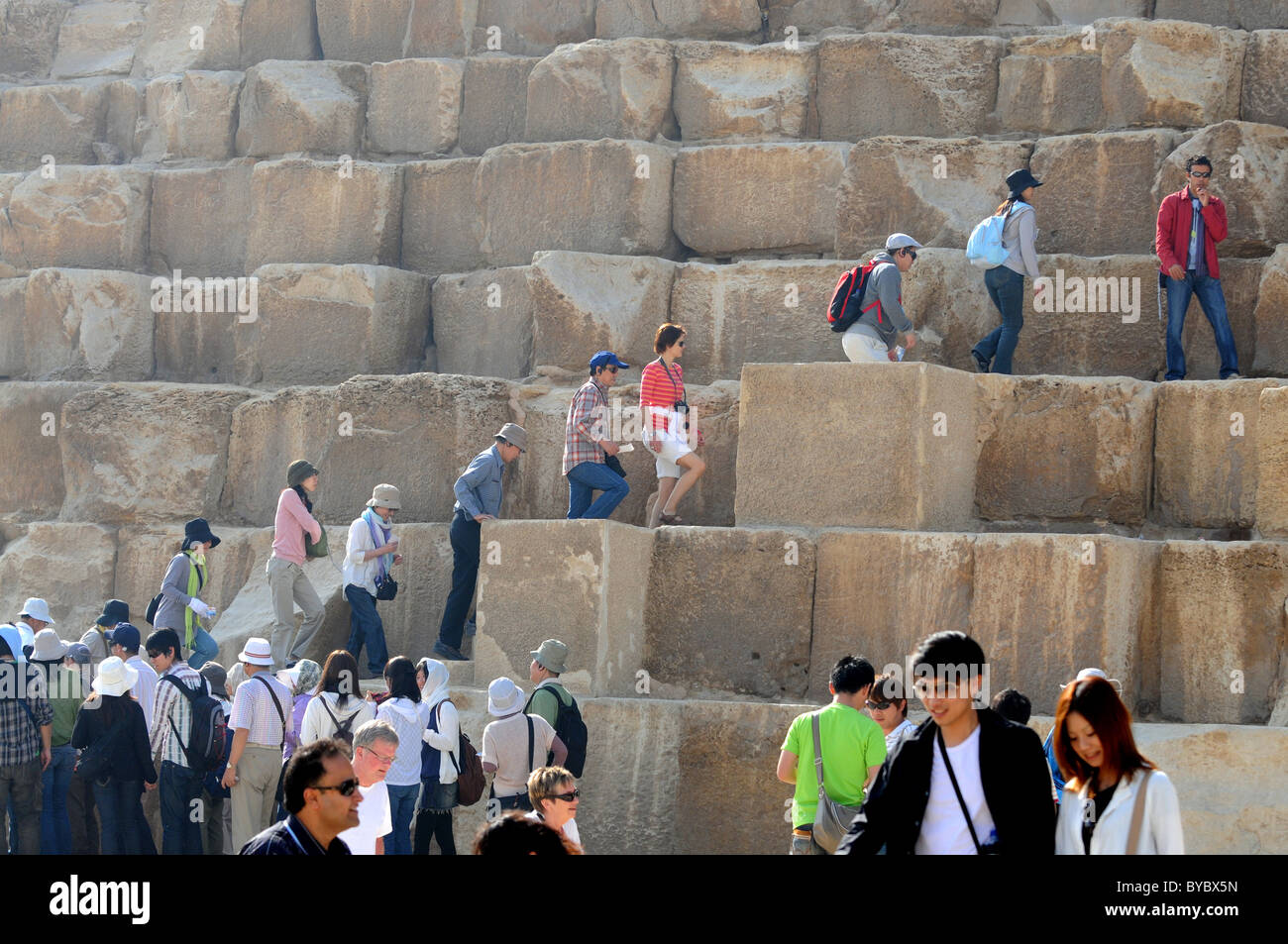 Pyramid, Giza, Egypt, tourists climb on the only open Pyramid, Giza ...