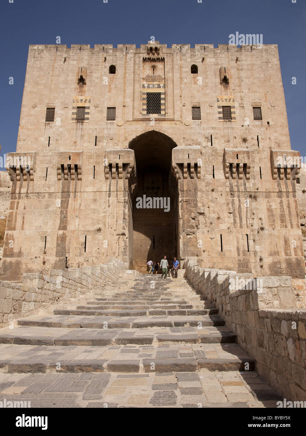 Entrance to Aleppo Citadel, Aleppo, Syria; tourists are dwarfed by the ...