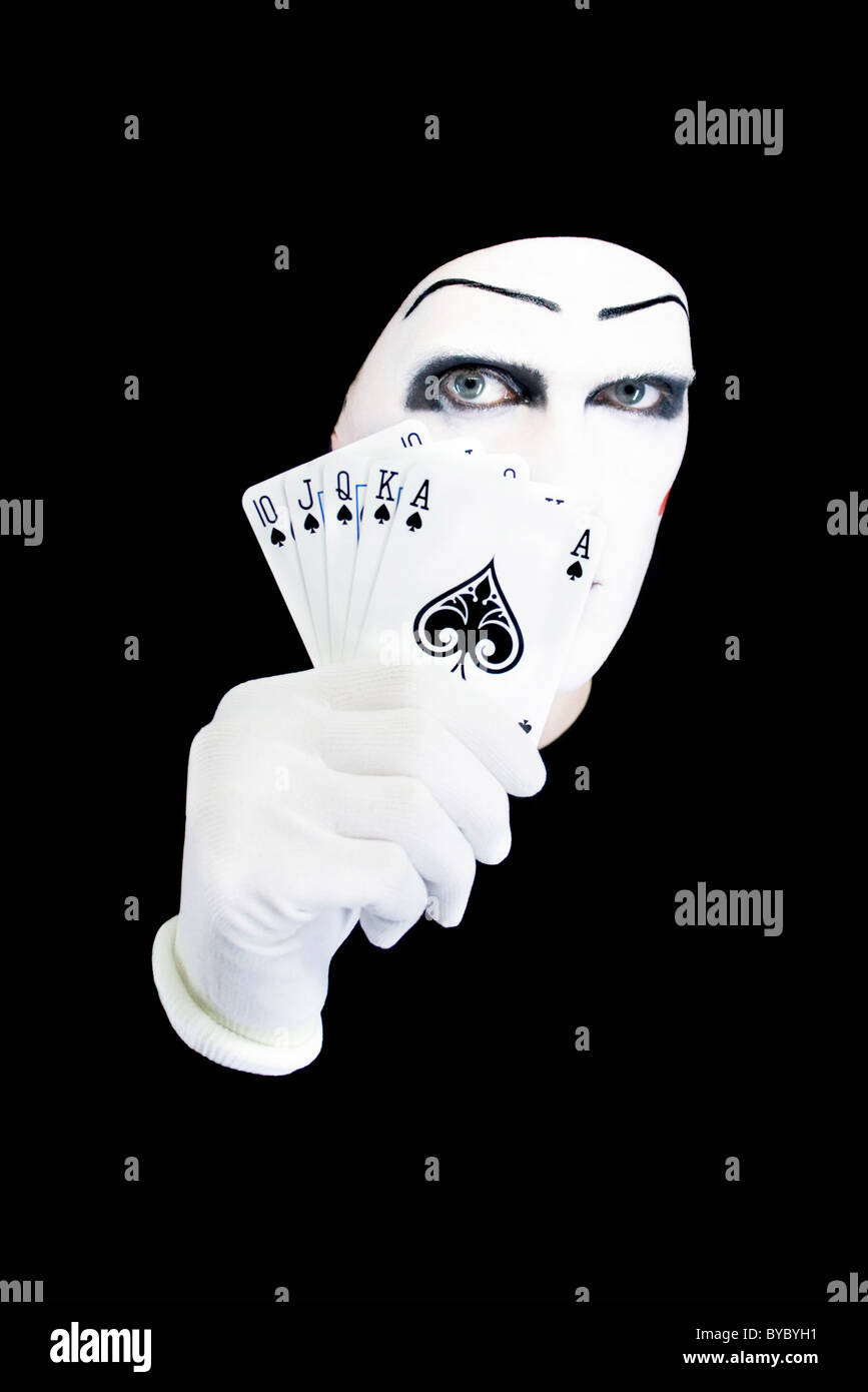 Portrait of the mime with playing cards on a black background Stock ...