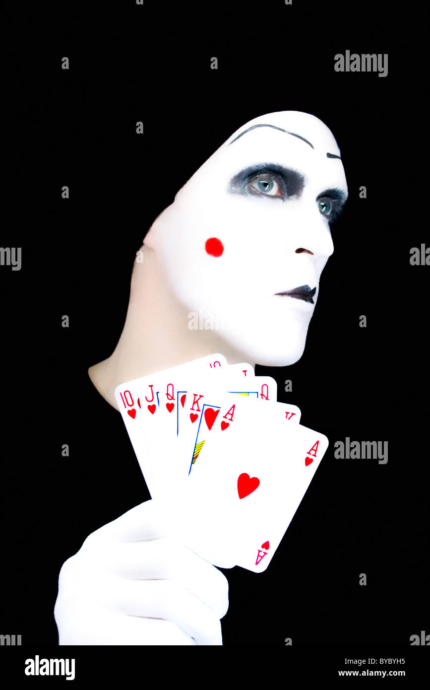 Portrait of the mime with playing cards on a black background Stock ...