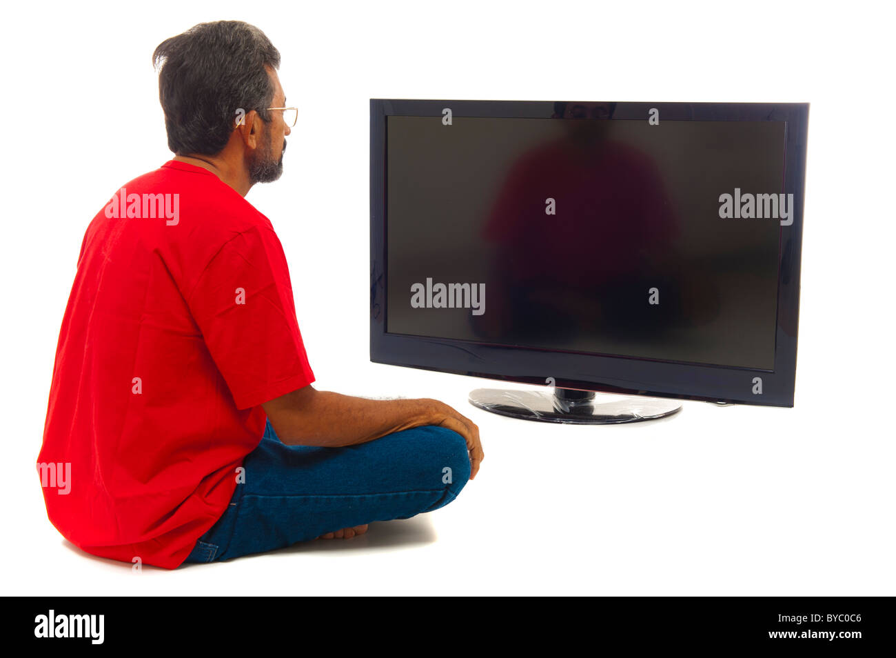 Man watching tv with hands on the head Stock Photo - Alamy