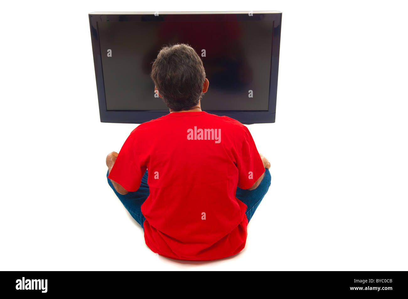 Man watching tv with hands on the head Stock Photo - Alamy