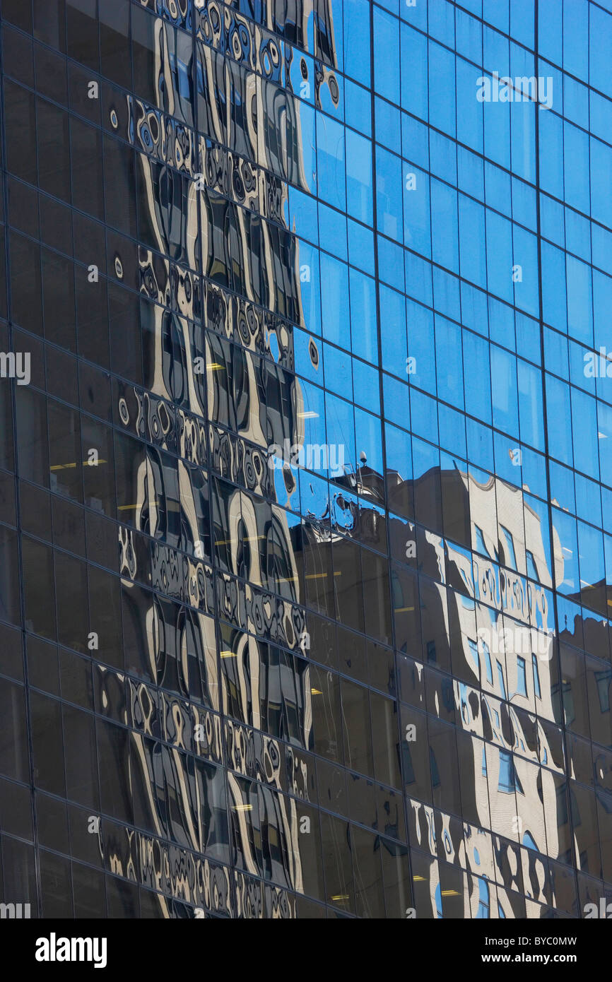 Reflections on glass building Stock Photo - Alamy
