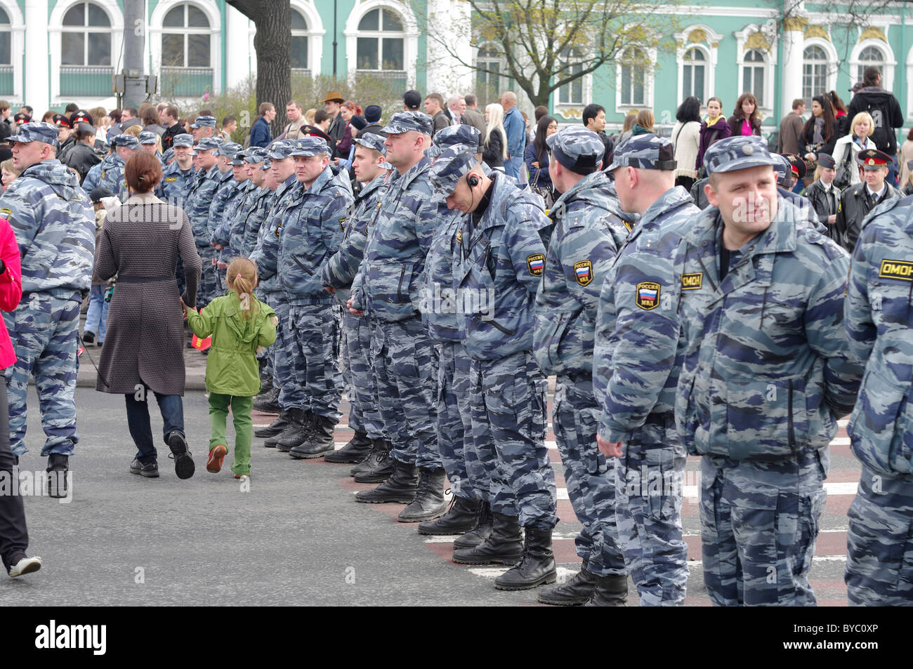 Russian policemen (militiamen) standing in line and protecting a ...