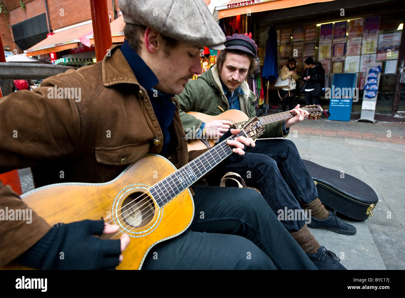 Two men playing guitars in London. Photograph by Gordon Scammell Stock ...