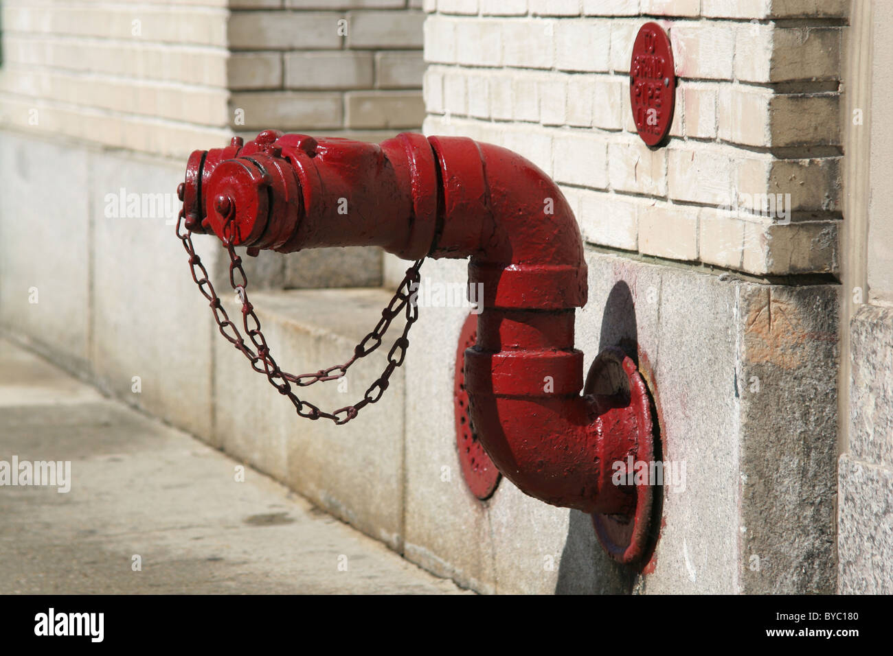 Fire hydrant inlet riser new york building Stock Photo - Alamy