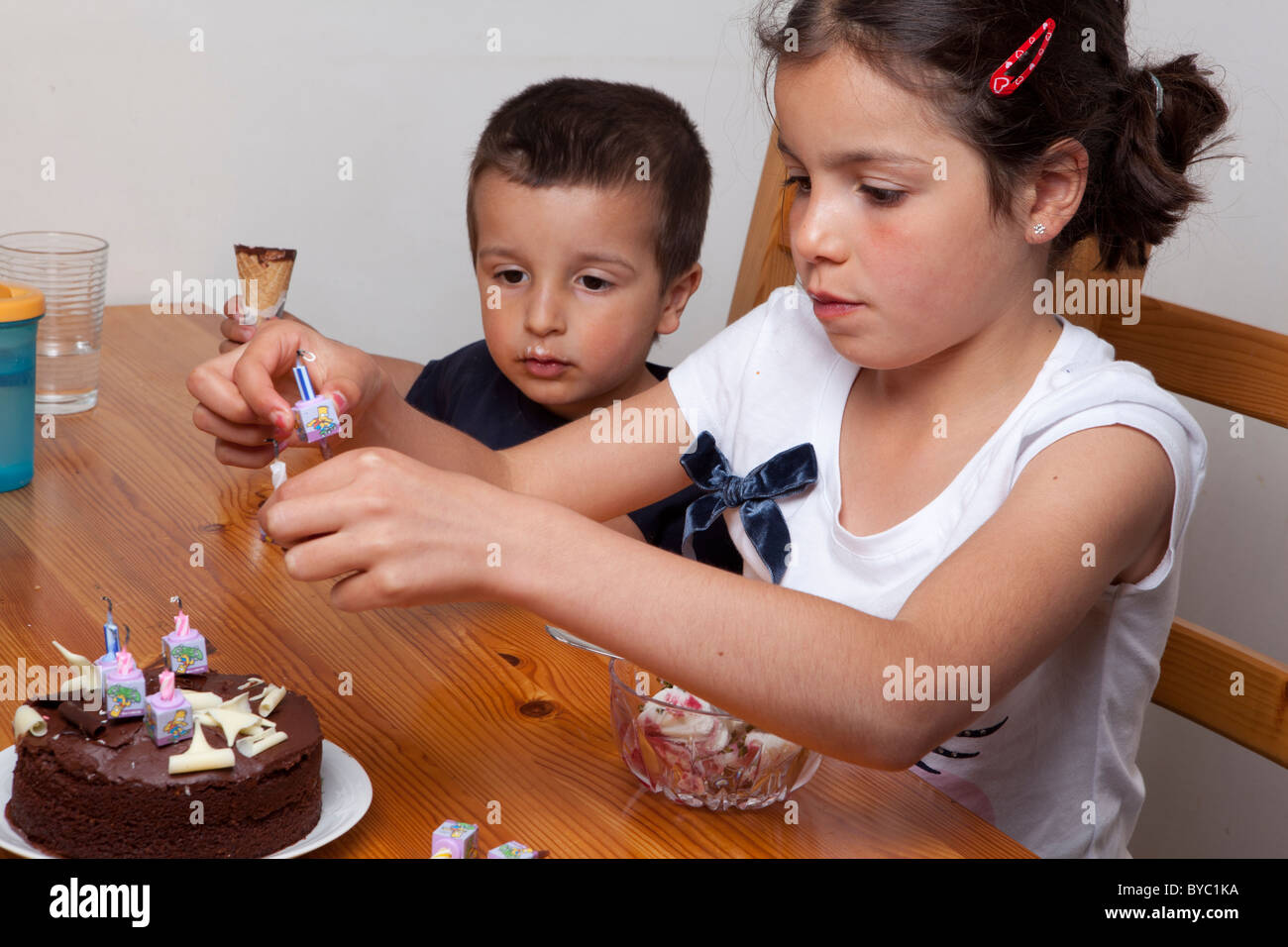 Siblings celebrating Birthday party Stock Photo - Alamy