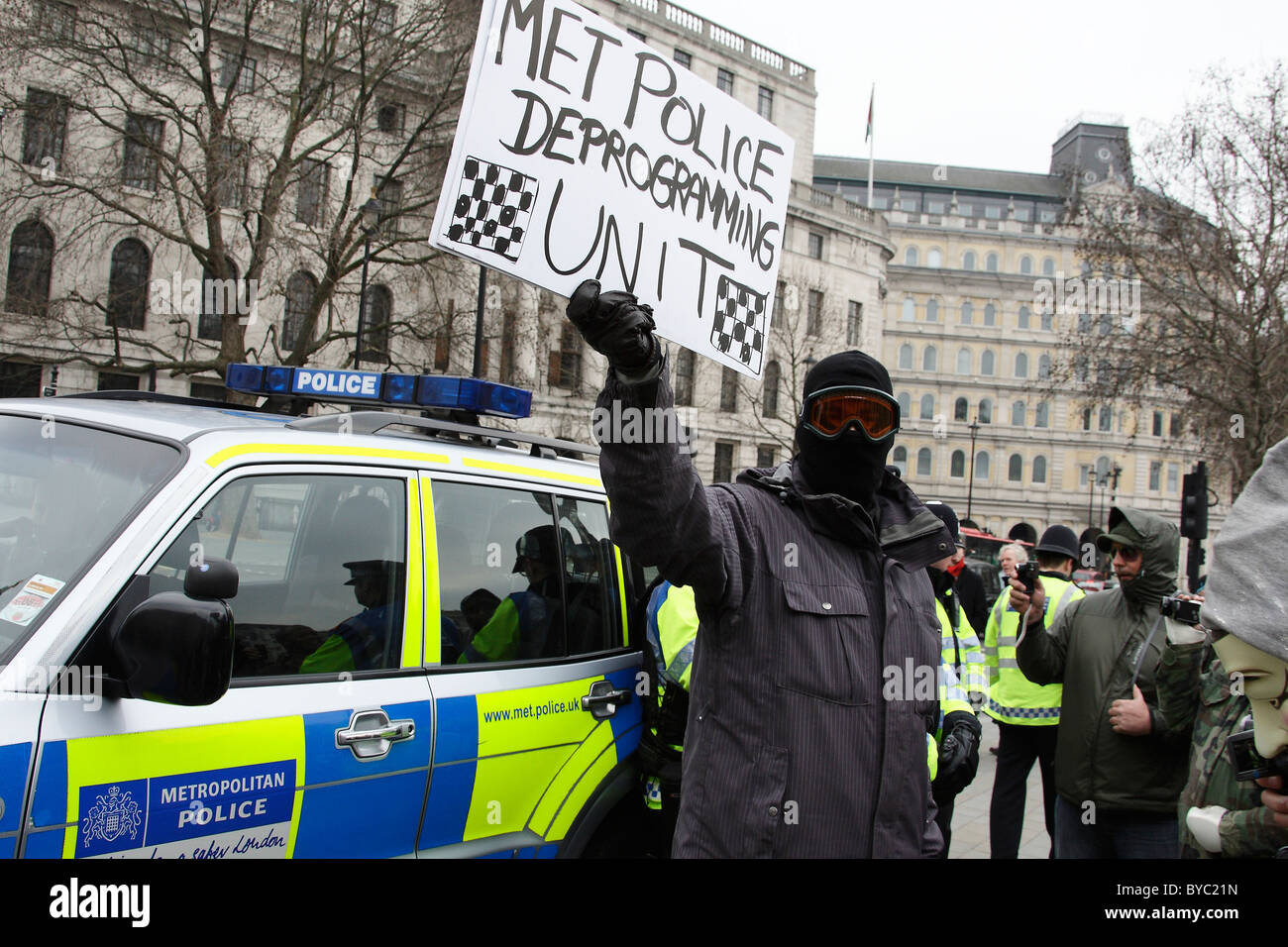 Anti police protester mocks police surveillance team Stock Photo - Alamy
