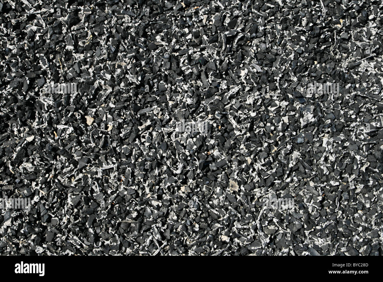 background of shredded pieces of rubber tire Stock Photo - Alamy