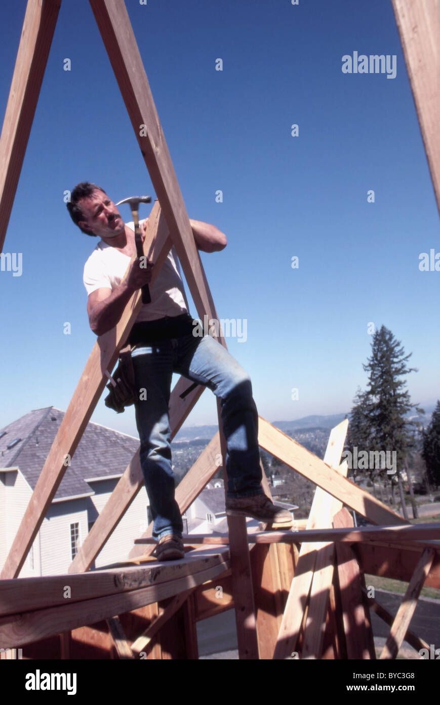 Construction and homebuilding worker framing a new house Stock Photo ...
