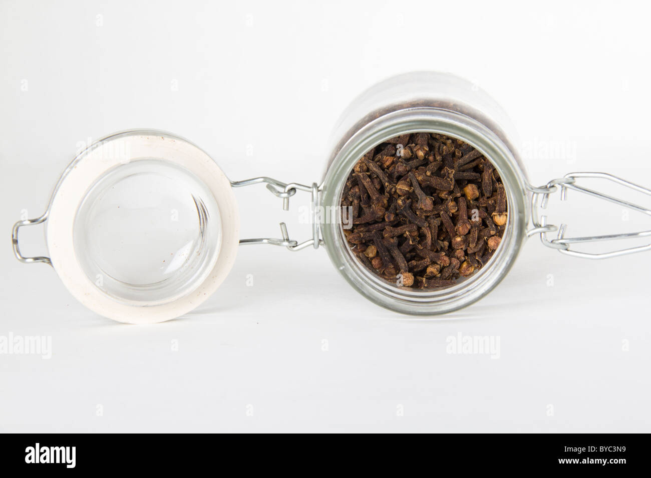 Cloves in a clear glass jar Stock Photo - Alamy