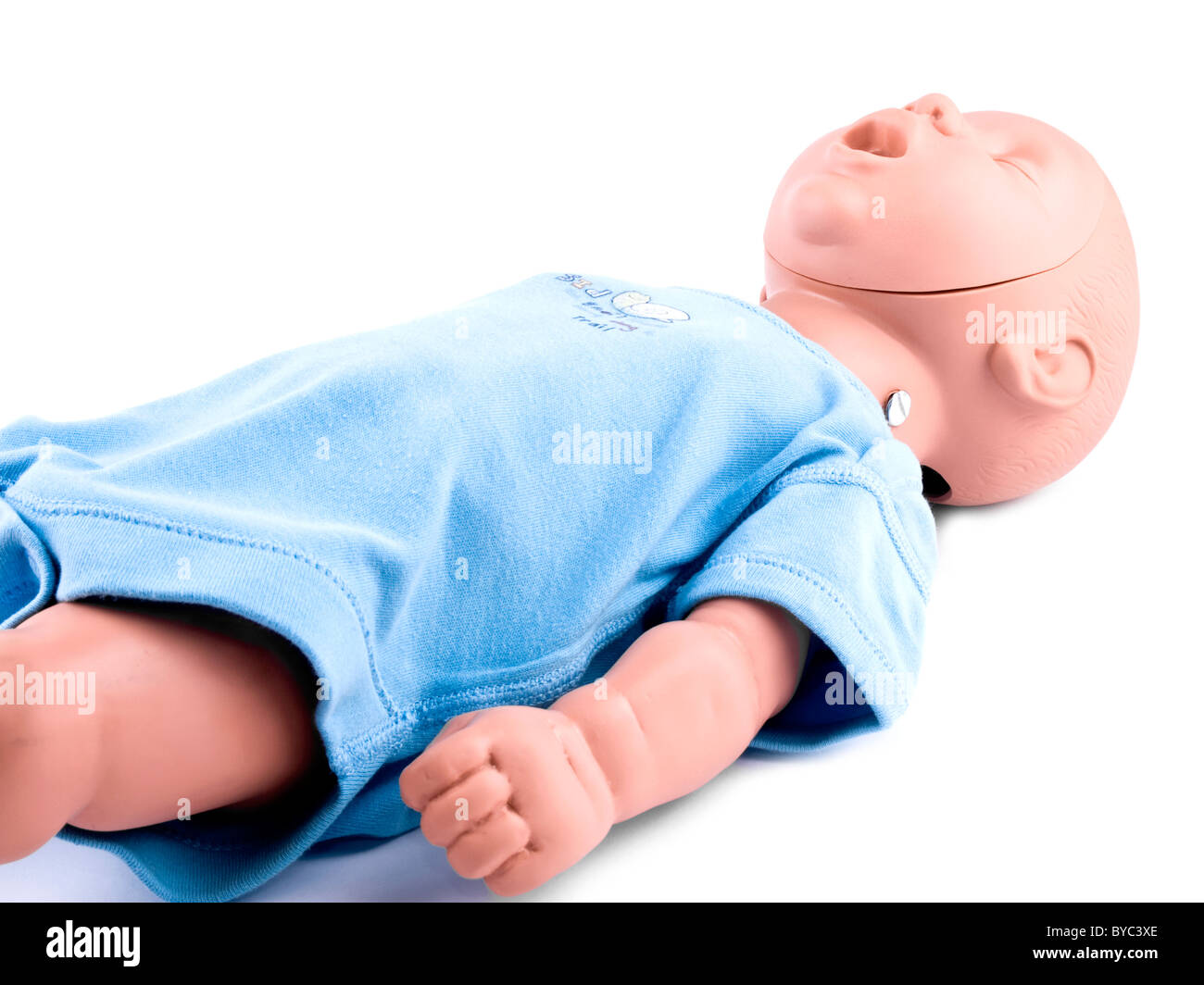 First aid training infant dummy on white background Stock Photo - Alamy