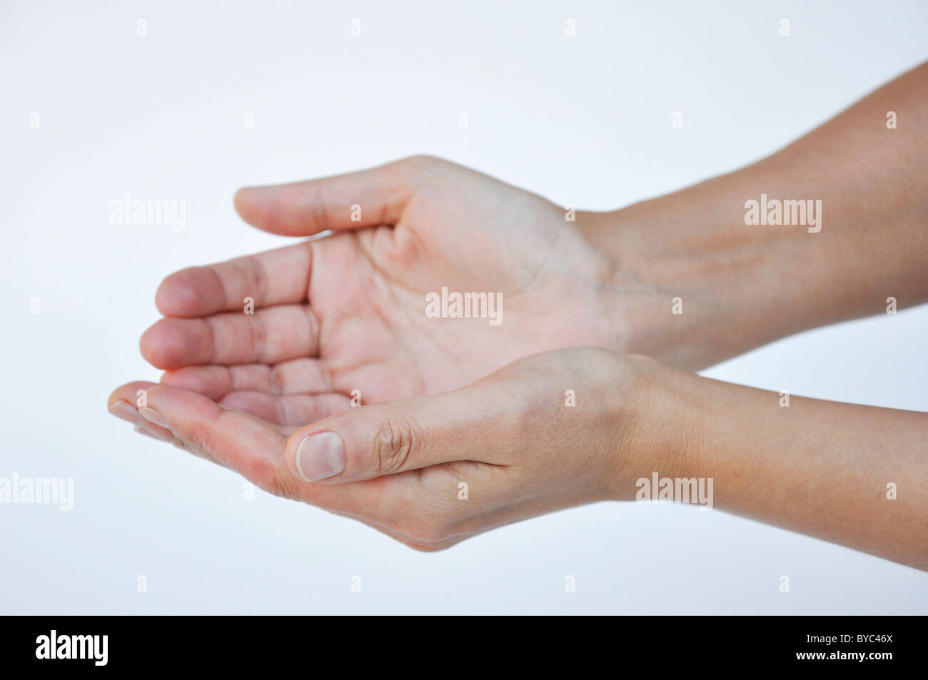 Female hands in holding position Stock Photo - Alamy