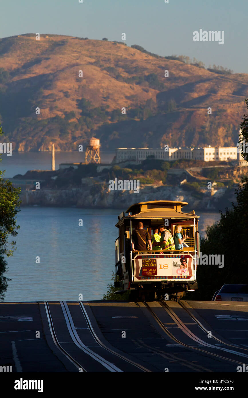 Powell-Hyde cable car with Alcatraz in the distance, San Francisco, CA ...