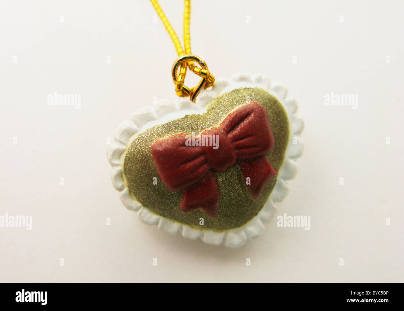 heart shaped trinket on a white background Stock Photo - Alamy