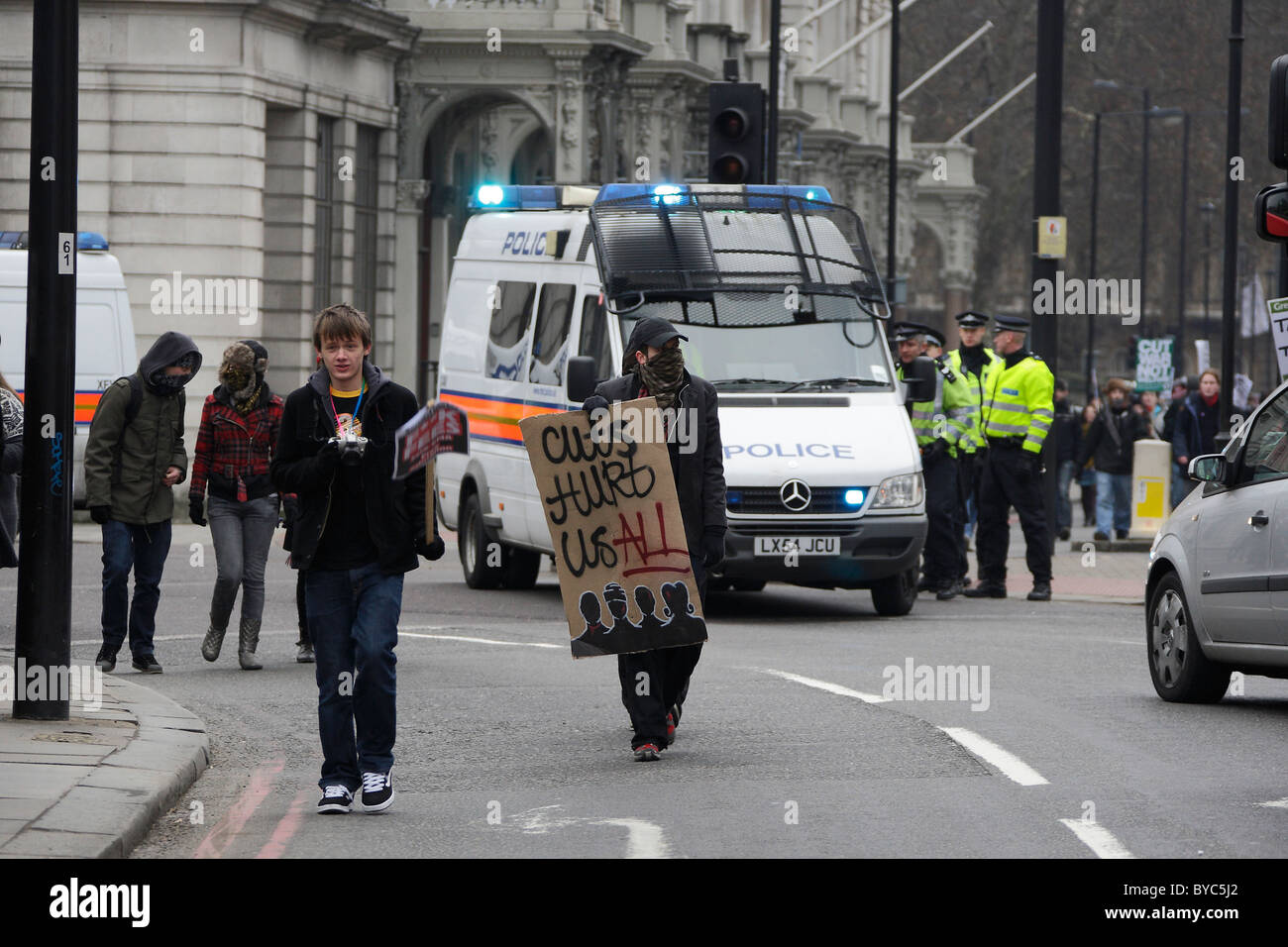Police rushing to head off protesters in london Stock Photo - Alamy