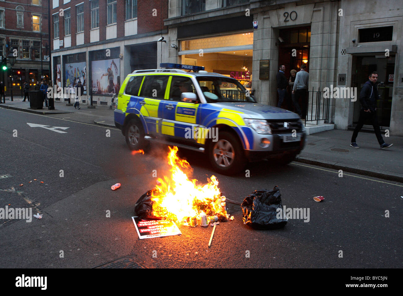 Protesters set a small fire in London Stock Photo - Alamy