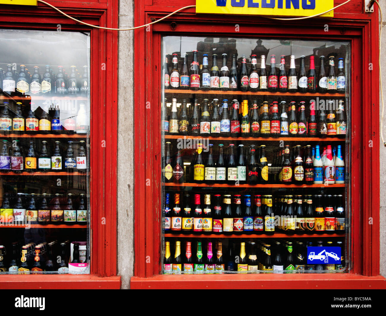 A large variety of local beer is display inside a shop window in Ghent ...