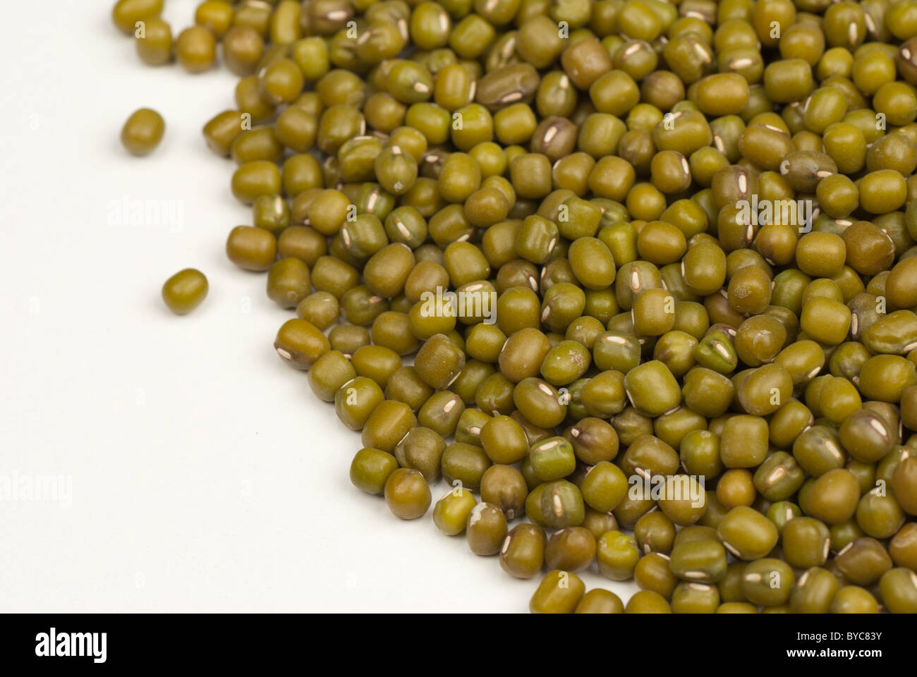 A heap of dried mung beans isolated on white Stock Photo - Alamy
