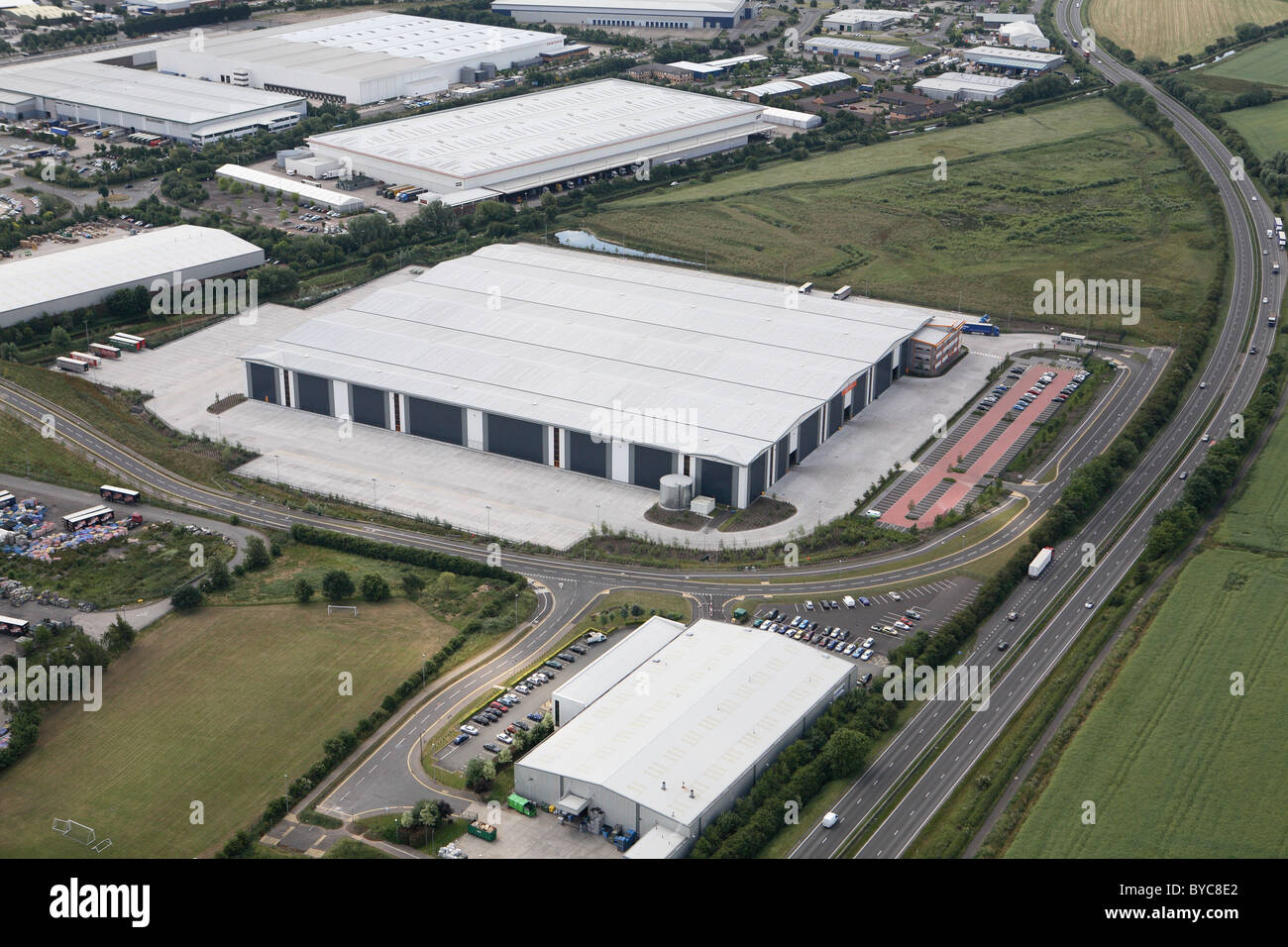 Large warehouse aerial view with transport links Stock Photo - Alamy