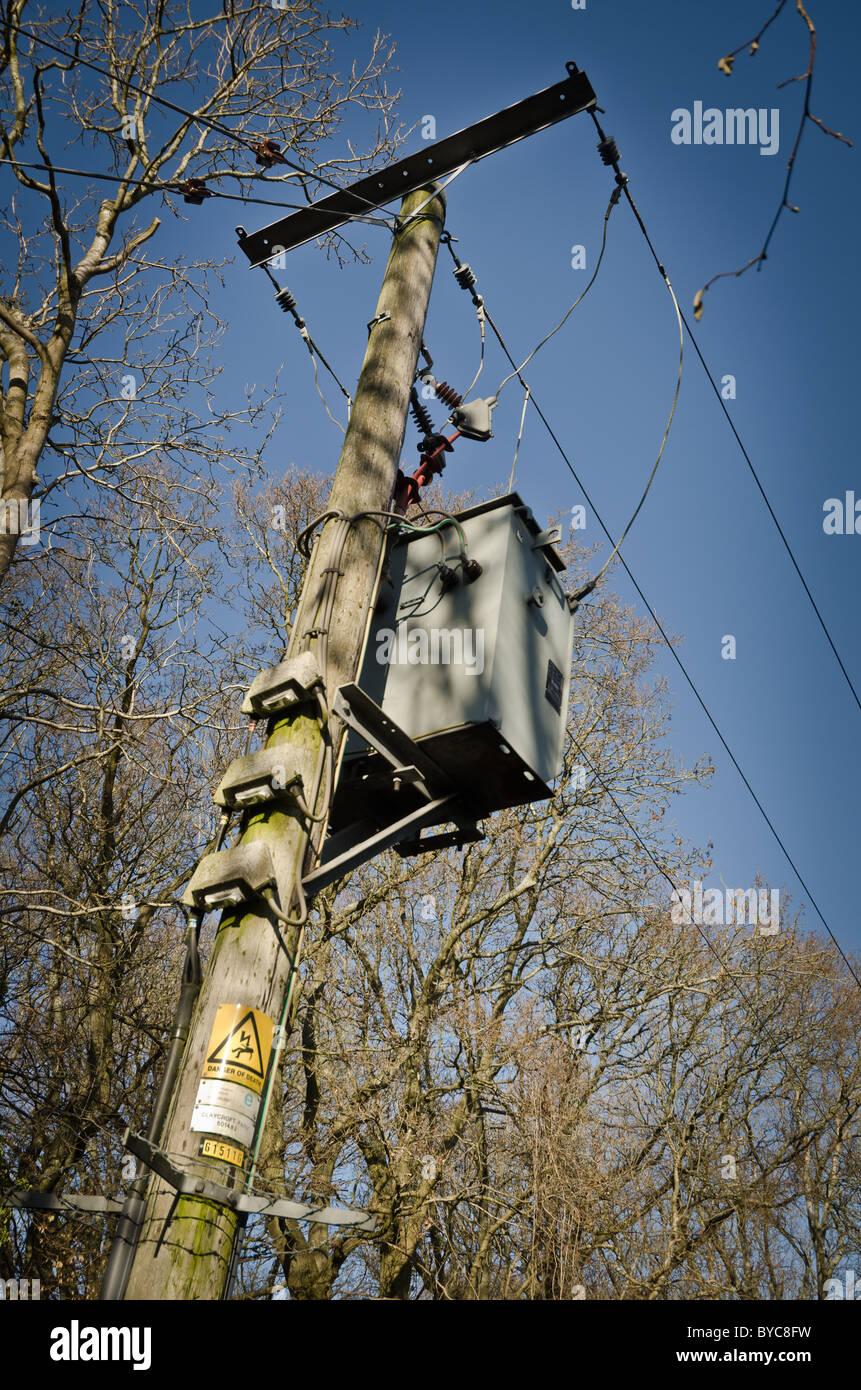 Electrical transformer on wooden pylon Stock Photo - Alamy